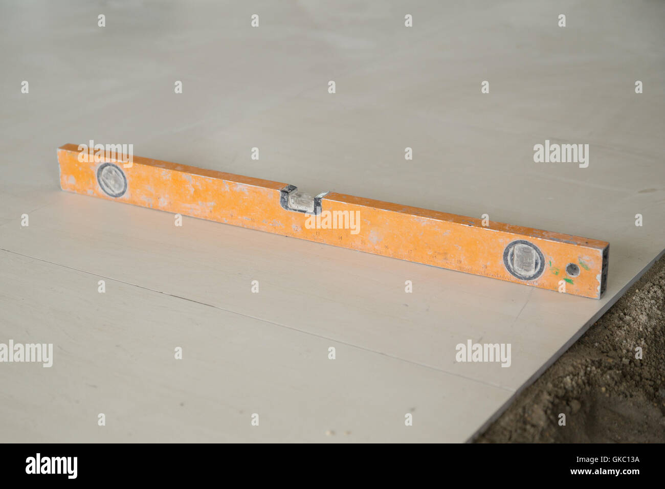 spirit level tool on floor tile at construction site Stock Photo - Alamy