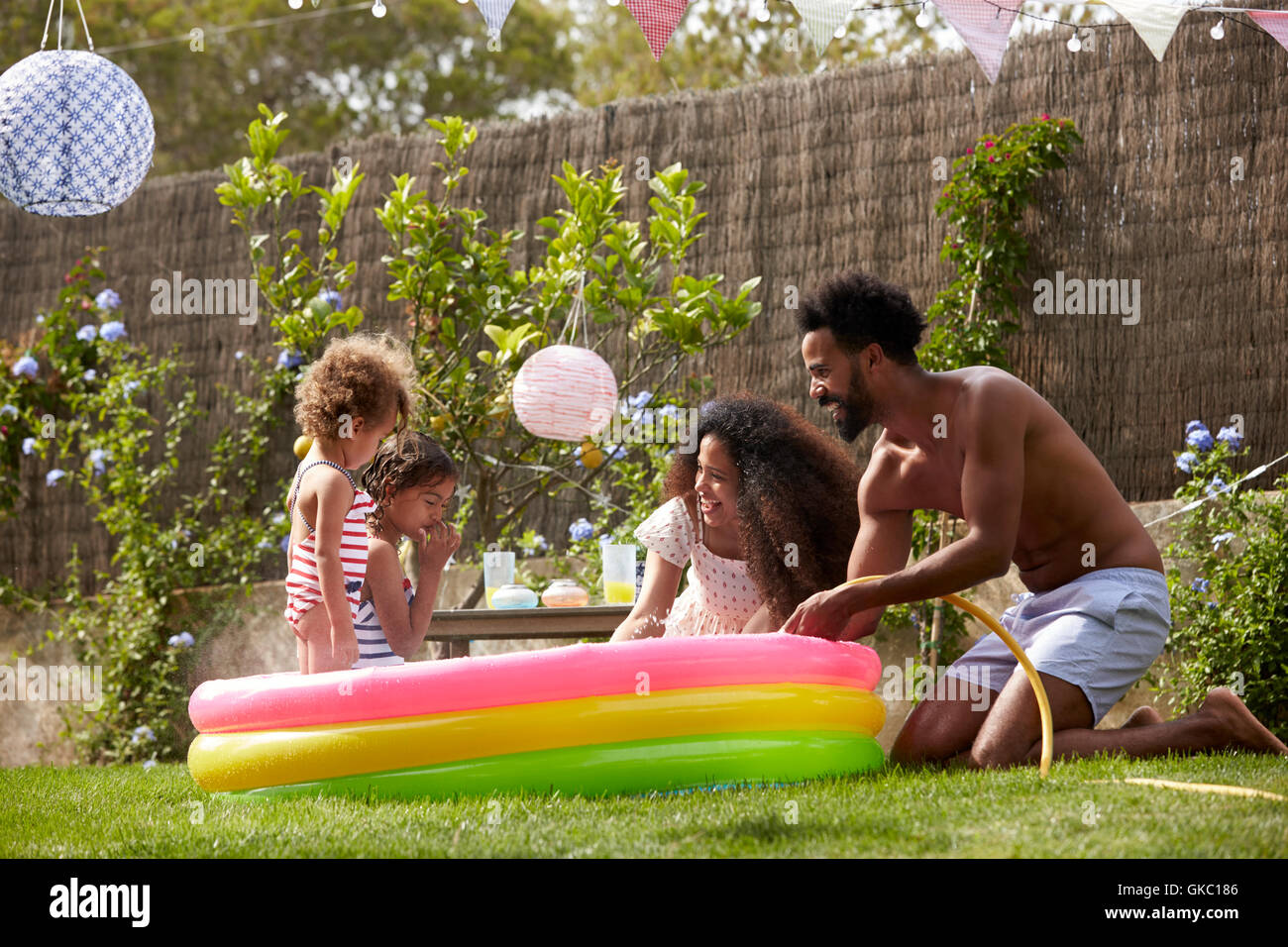 Woman paddling pool garden hi-res stock photography and images - Alamy