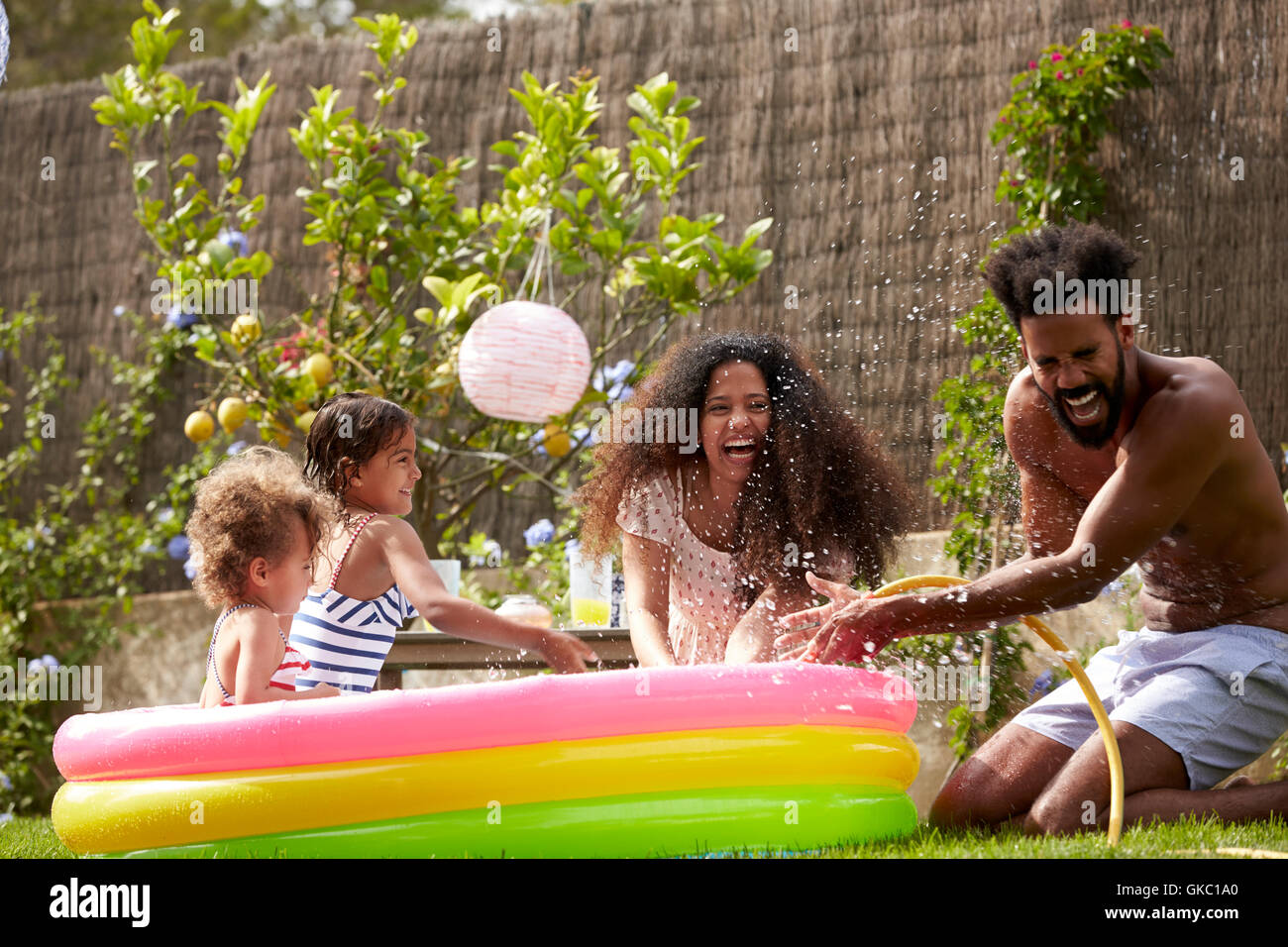 Woman paddling pool garden hi-res stock photography and images - Alamy