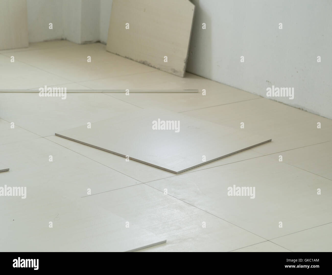 new Tiles floor, prepare for working tiles Stock Photo - Alamy