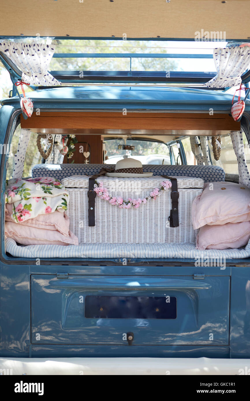 Open back of a retro camper van, with luggage, vertical Stock Photo - Alamy