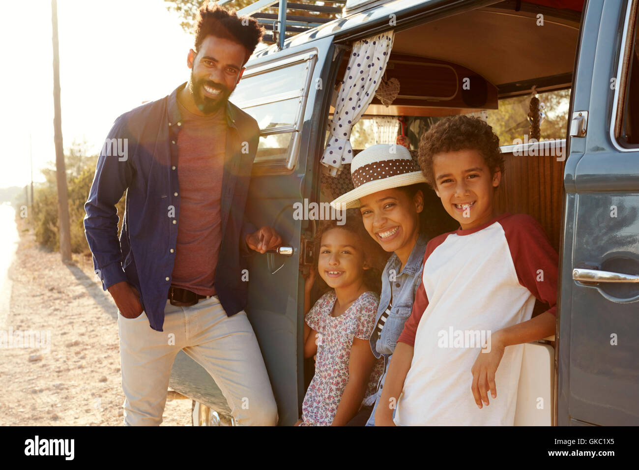 Young family make a stop on a road trip in their camper van Stock Photo ...