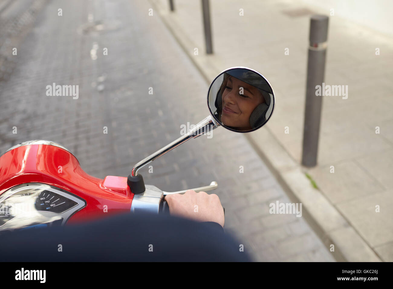 Man riding motor scooter, point of view detail of hand Stock Photo - Alamy