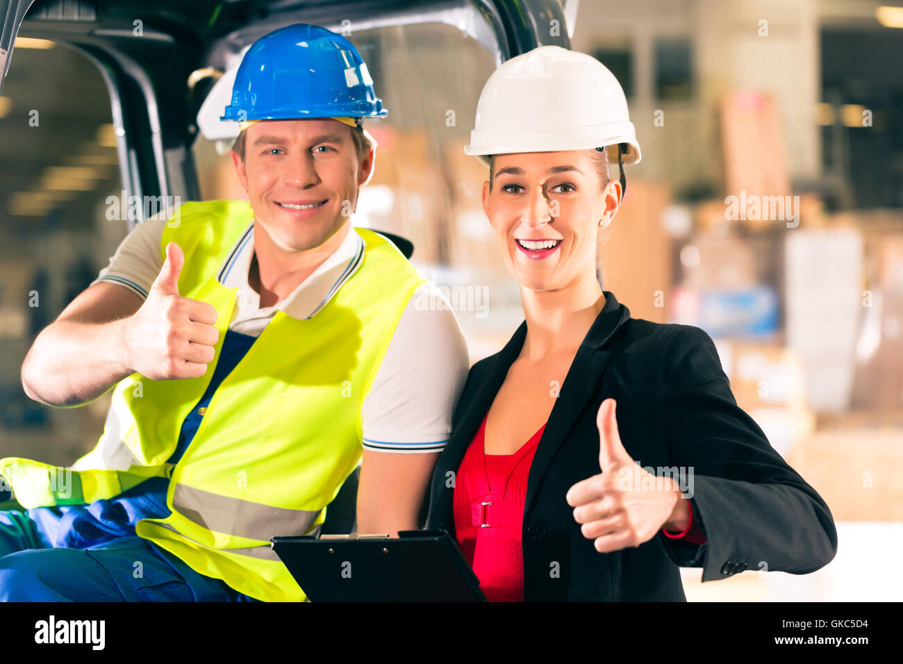 forklift driver and colleague,in storage of freight forwarding Stock ...