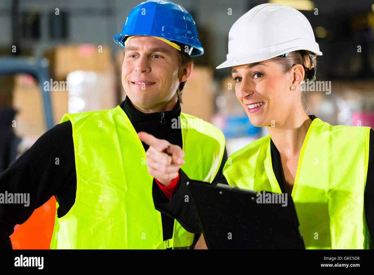 forklift driver and colleague,in storage of freight forwarding Stock ...