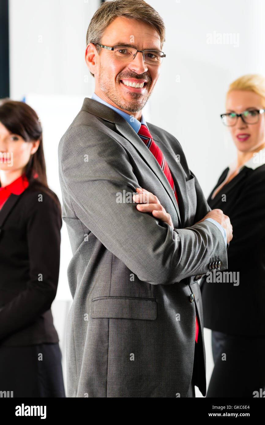 business - a group of businessmen in an office Stock Photo - Alamy