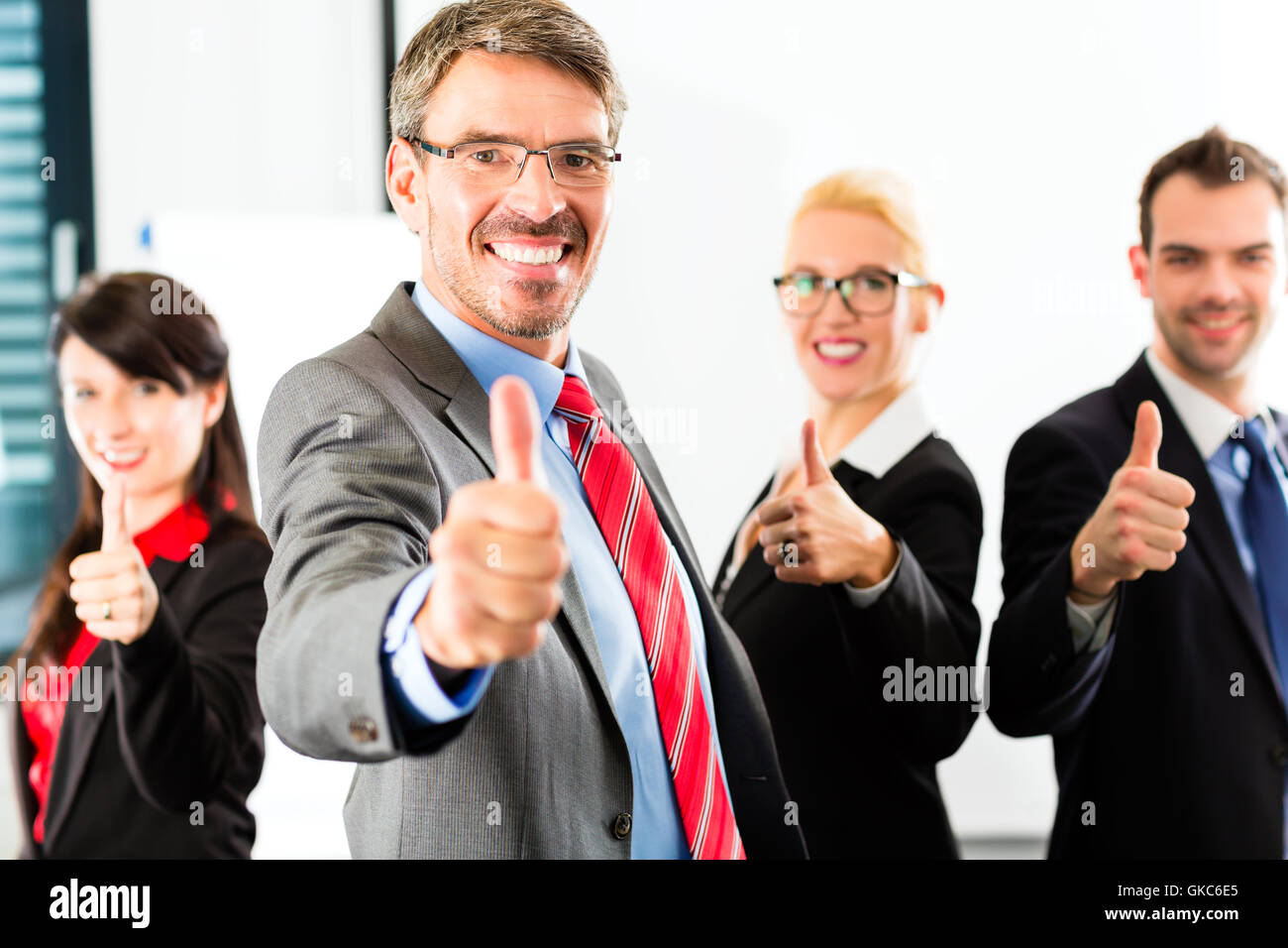 business - a group of businessmen in an office Stock Photo - Alamy