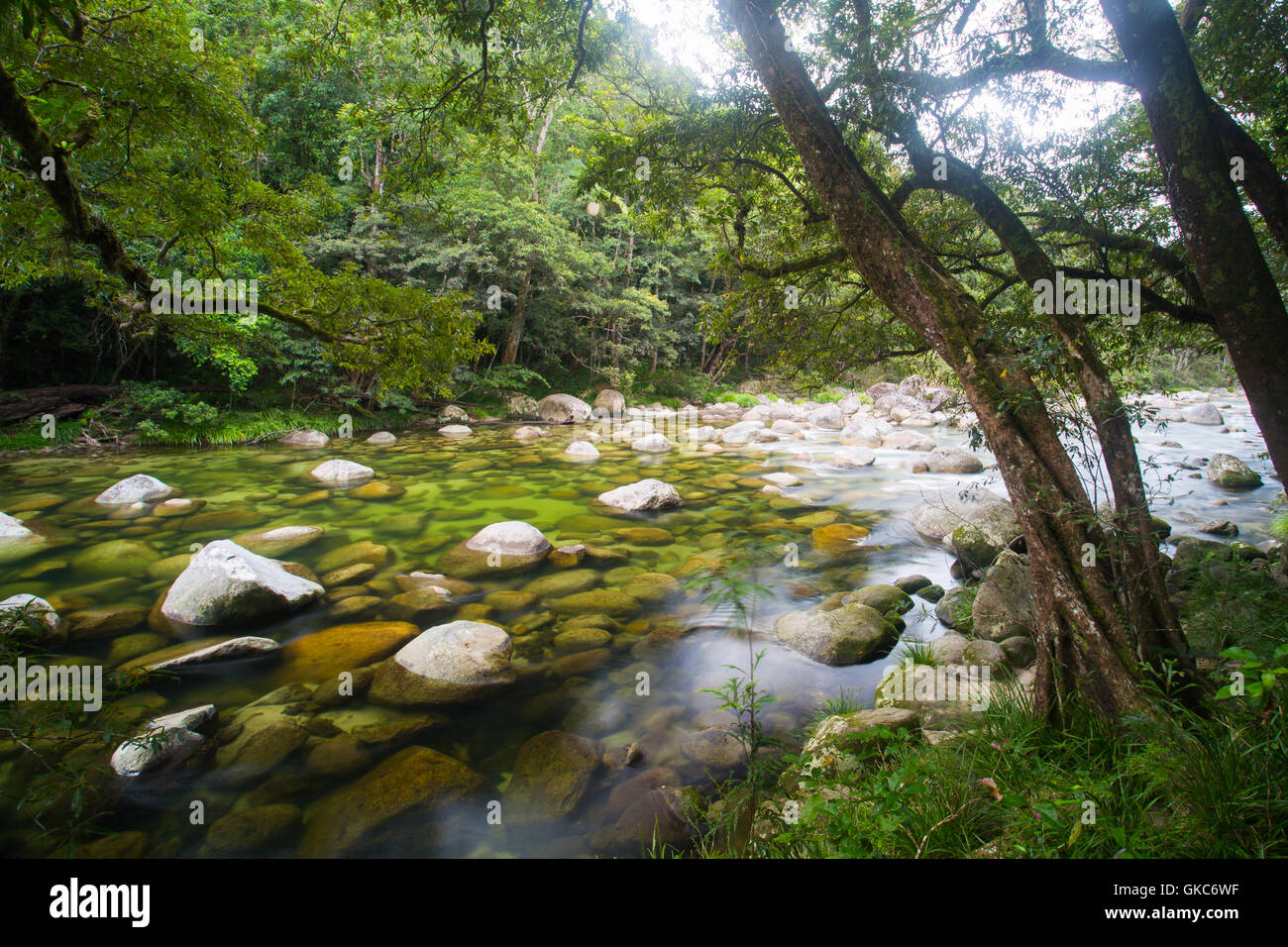 Water of the Mossman River flows over ancient rocks and boulders in ...