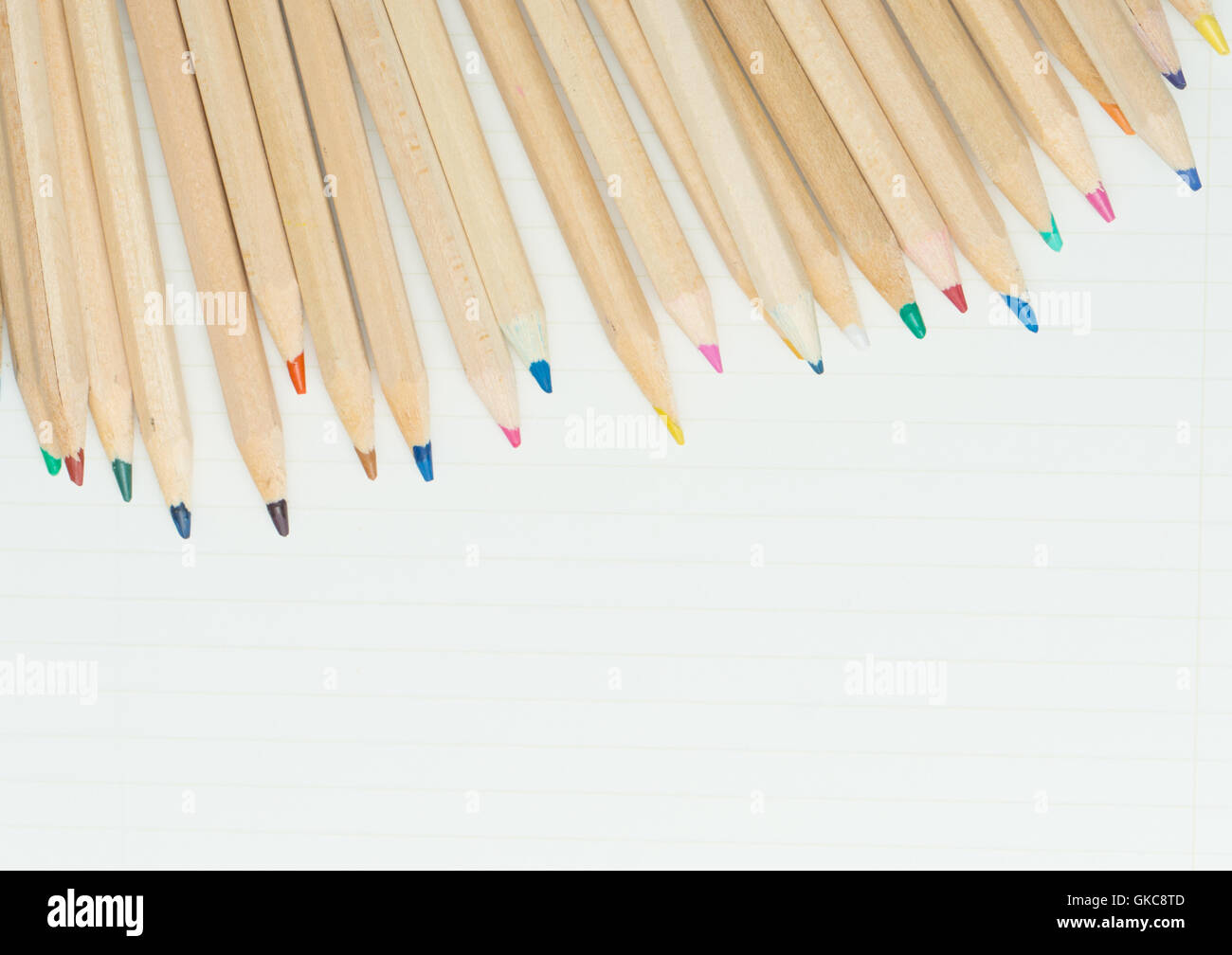 many colored pencils on white paper Stock Photo - Alamy