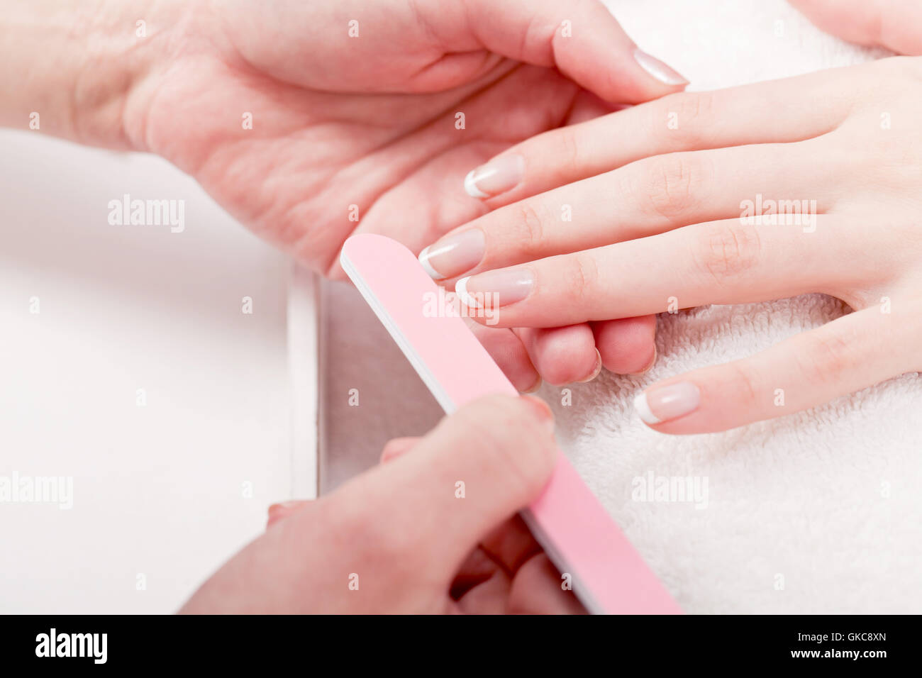 professional nail technician at a manicure with female Stock Photo - Alamy