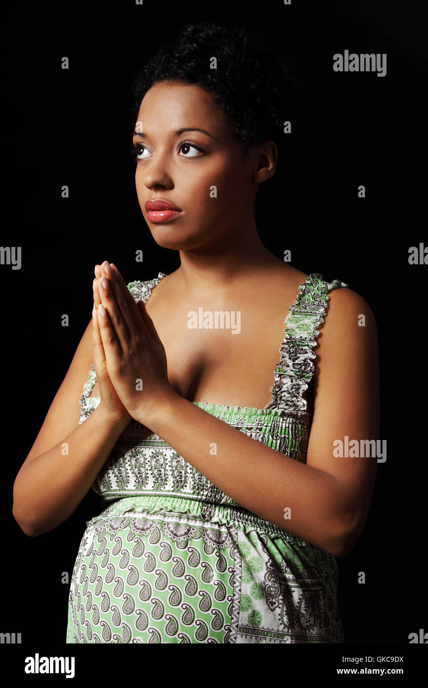 Woman in deep prayer hi-res stock photography and images - Alamy