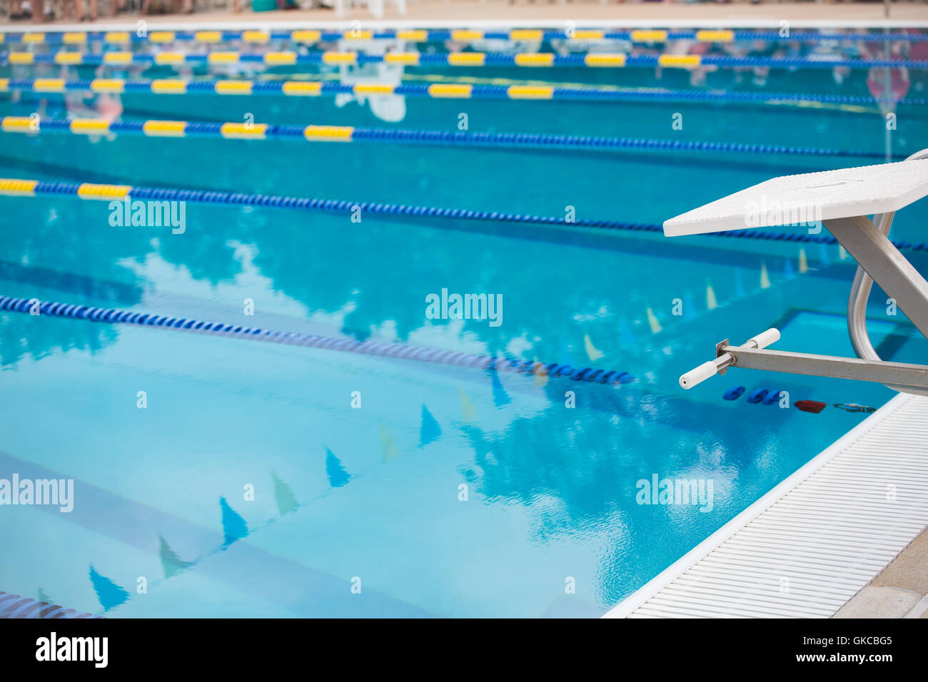 Empty diving block stands before the race lanes in a swimming pool ...