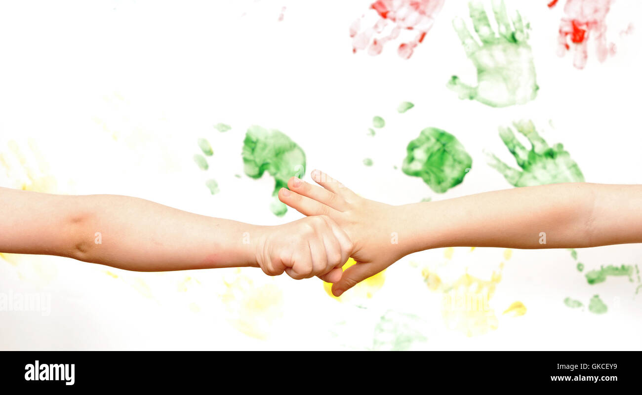 Chain of children's hands on a white background Stock Photo - Alamy