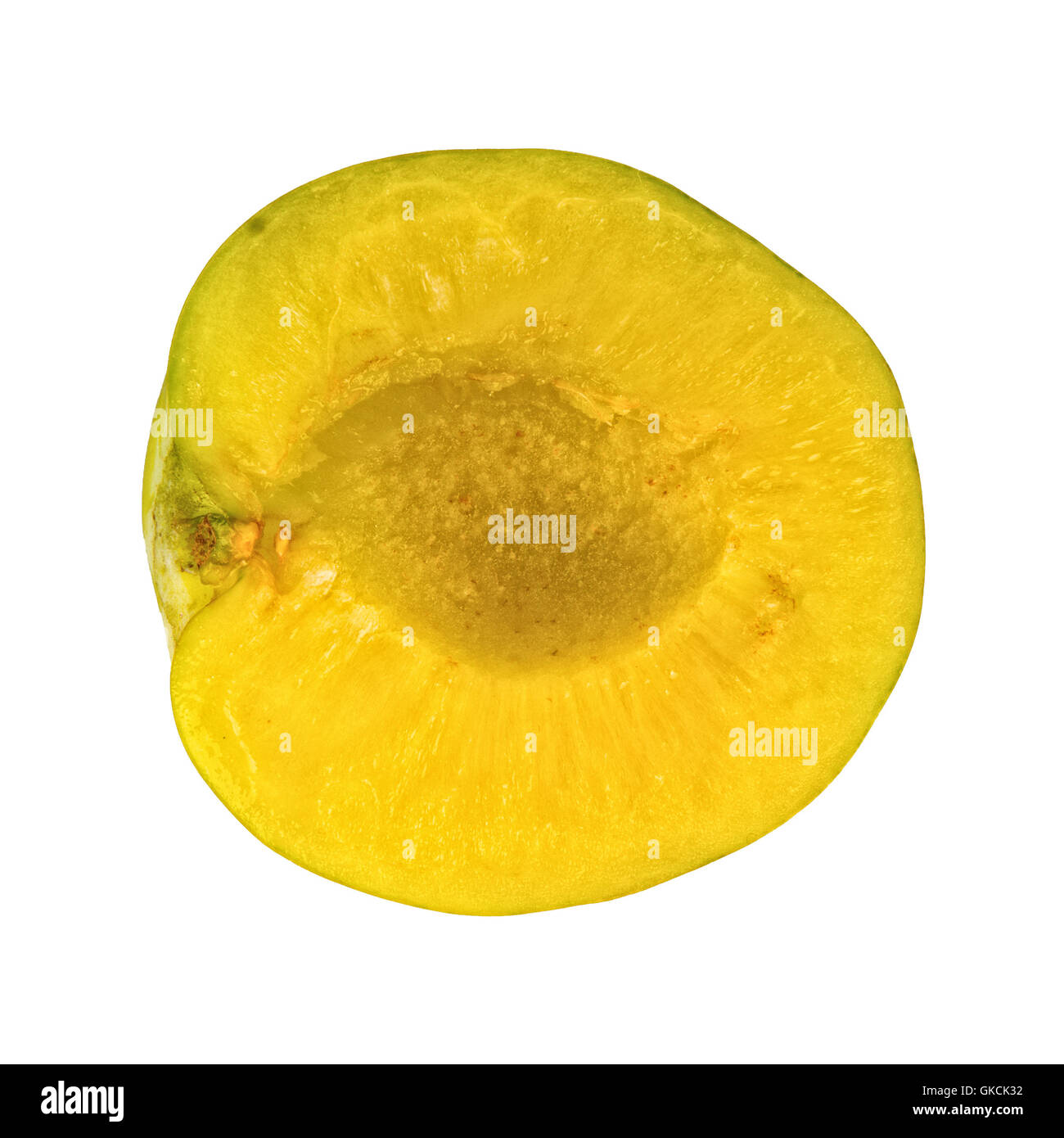 Greenish-yellow cut plum isolated on a white background Stock Photo - Alamy