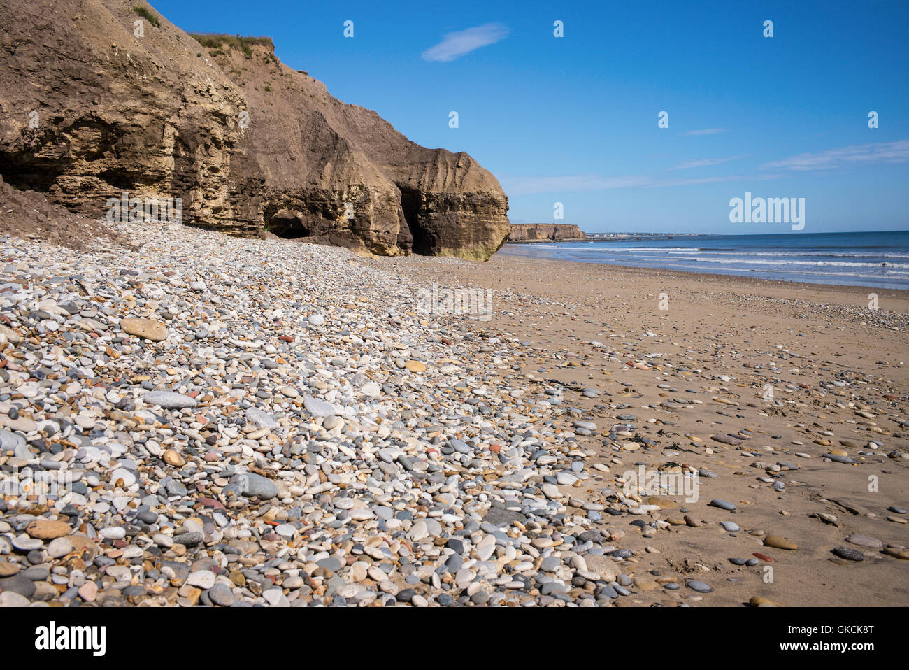 Cliffs of yellow coloured Magnesian Limestone rock at Seaham Beach ...