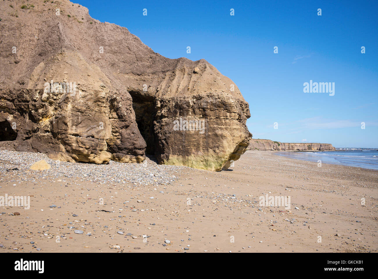 Cliffs of yellow coloured Magnesian Limestone rock at Seaham Beach ...
