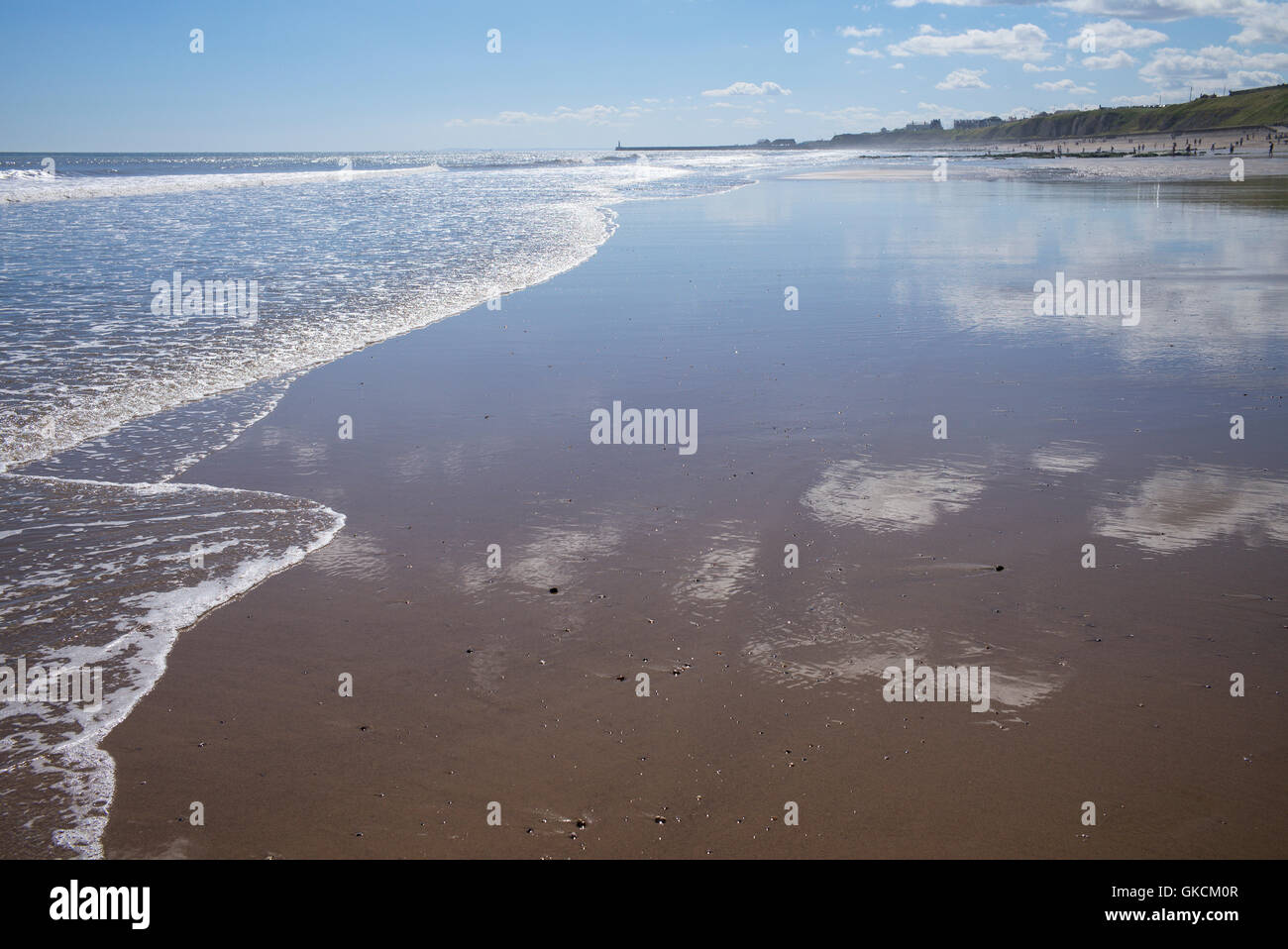 Reflections of clouds in pools at low tide, Seaham Beach, County Durham ...
