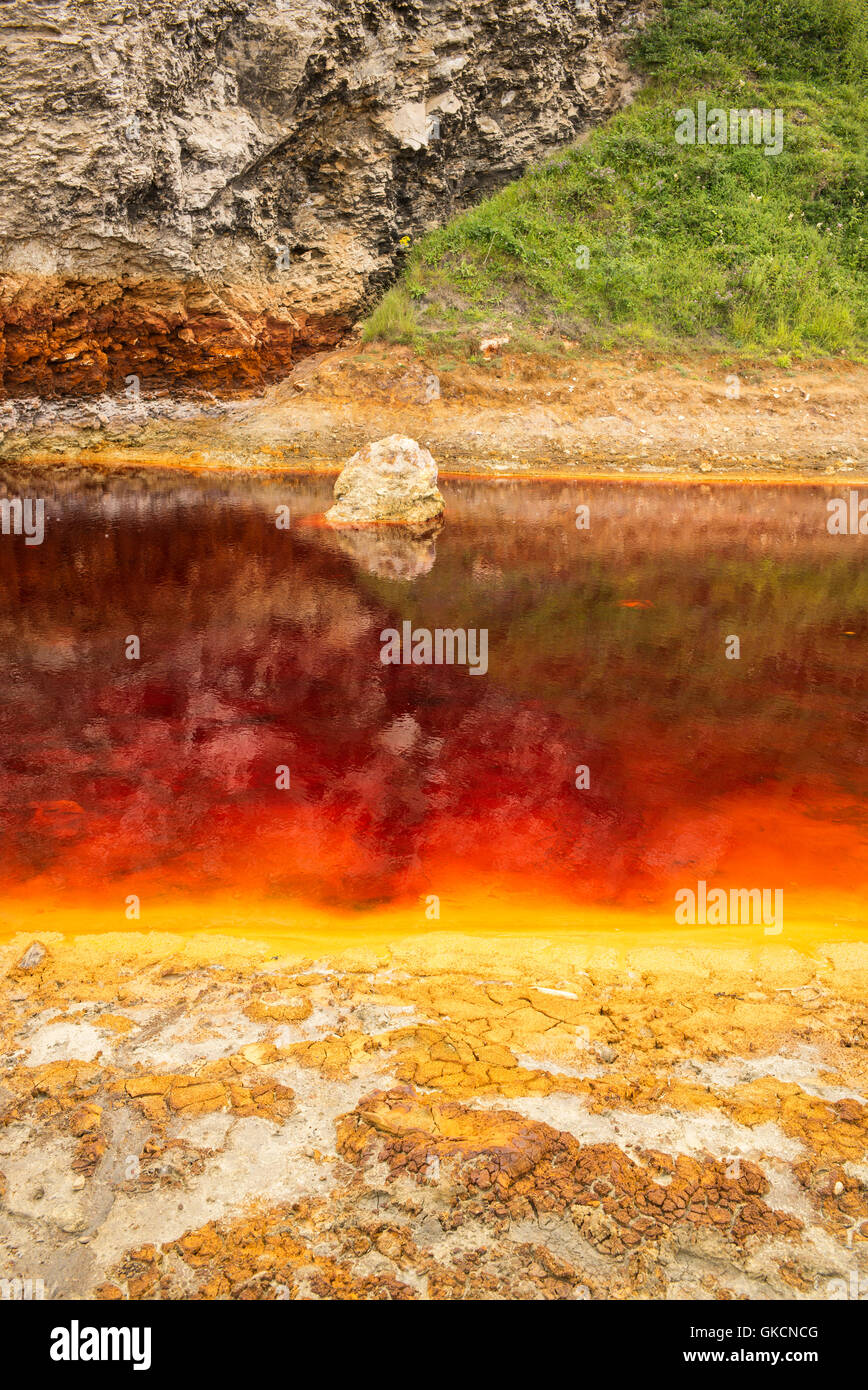 Water polluted from the residue of waste material from coal mining ...