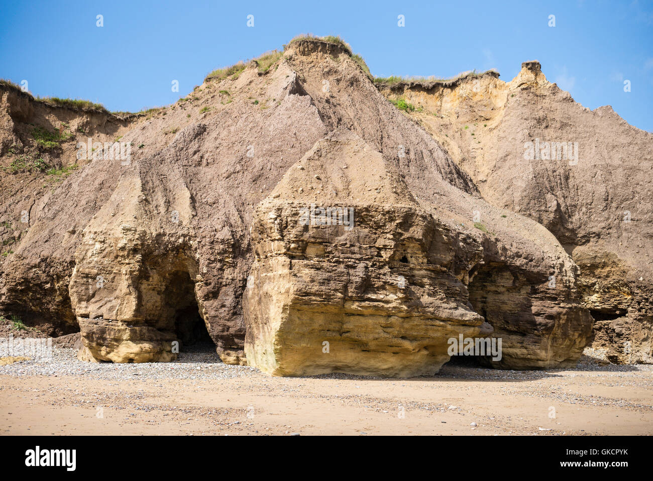 Cliffs of yellow coloured Magnesian Limestone rock at Seaham Beach ...