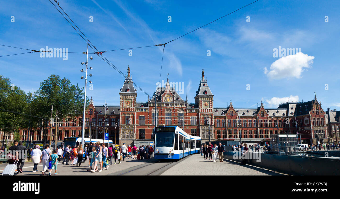Trams leaving the Amsterdam Centraal Station in Amsterdam Holland The ...