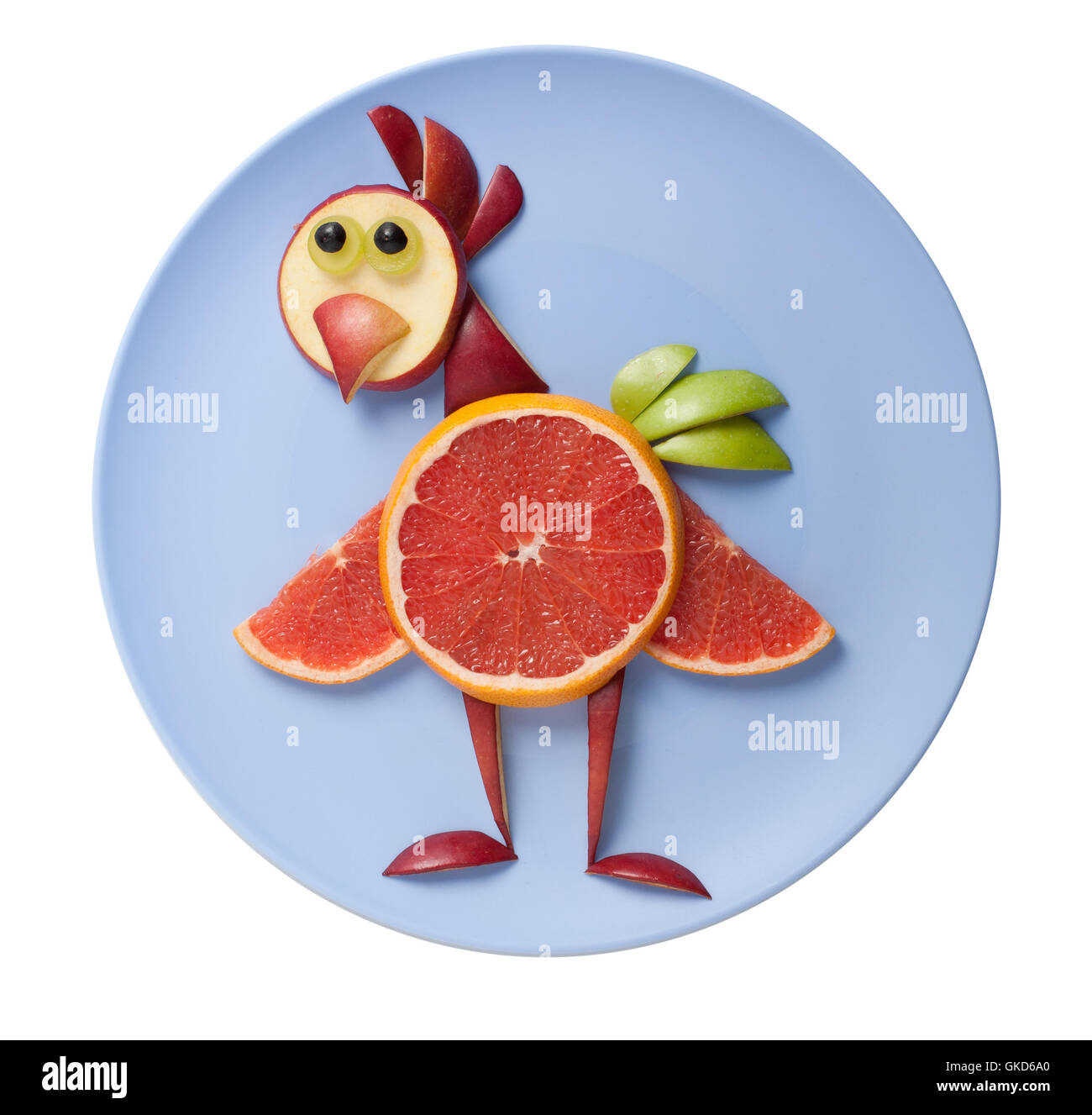 Amusing chicken made of fruits on blue plate Stock Photo - Alamy
