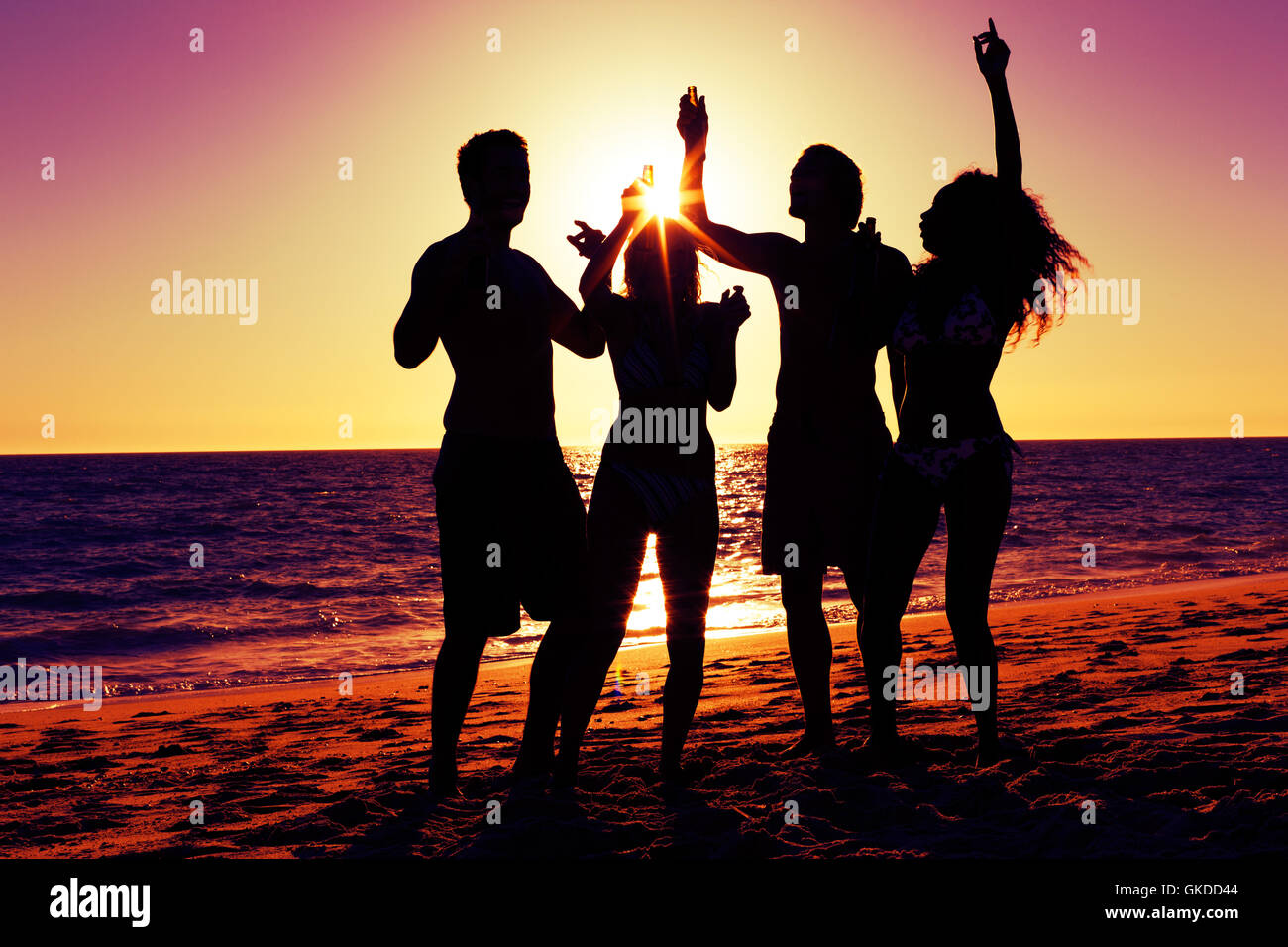 people partying on the beach with drinks Stock Photo - Alamy