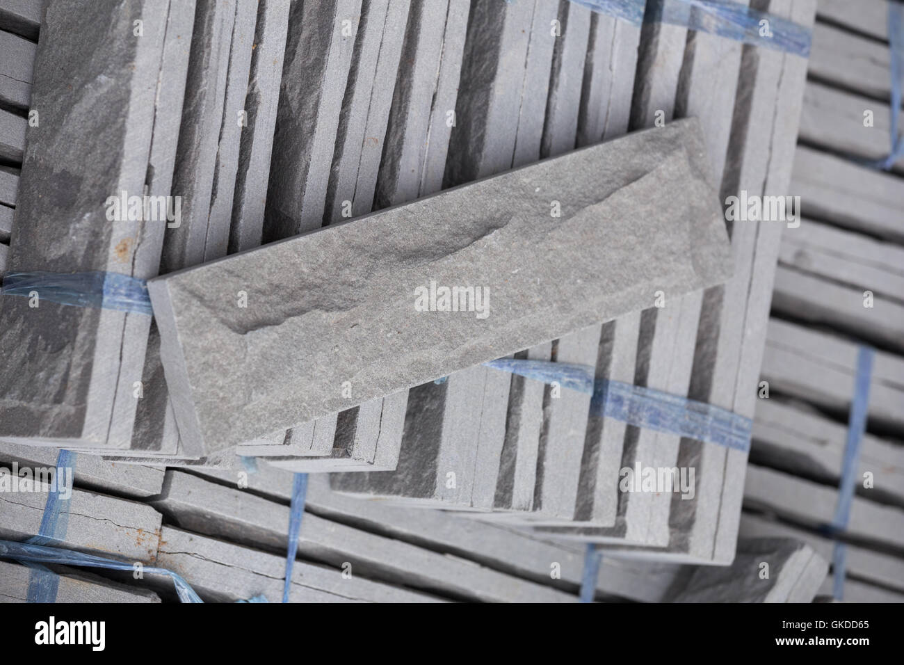pile of gray stone tiles prepare for install with cement for house ...