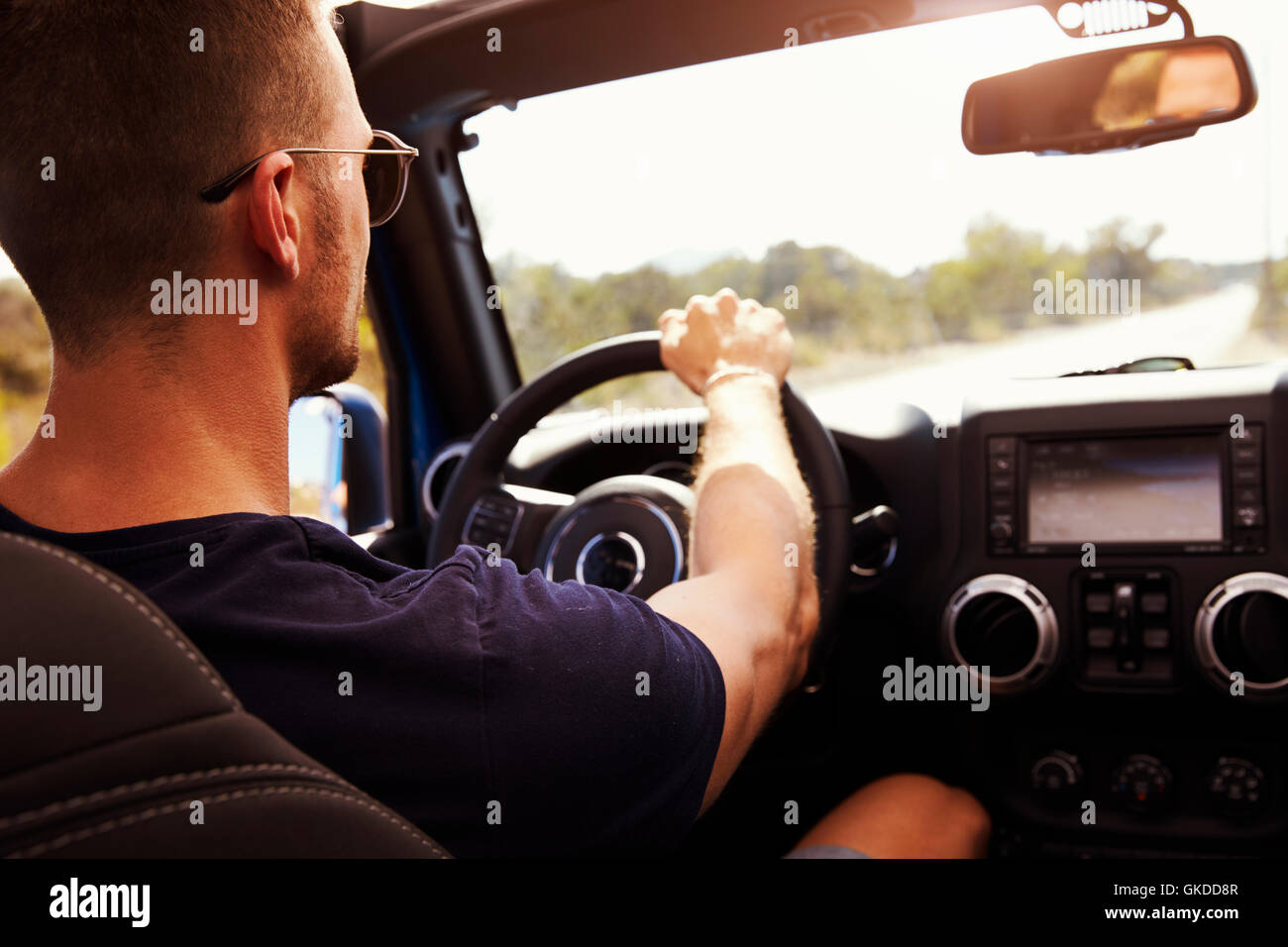 Man Driving Open Top Car On Country Road Stock Photo - Alamy