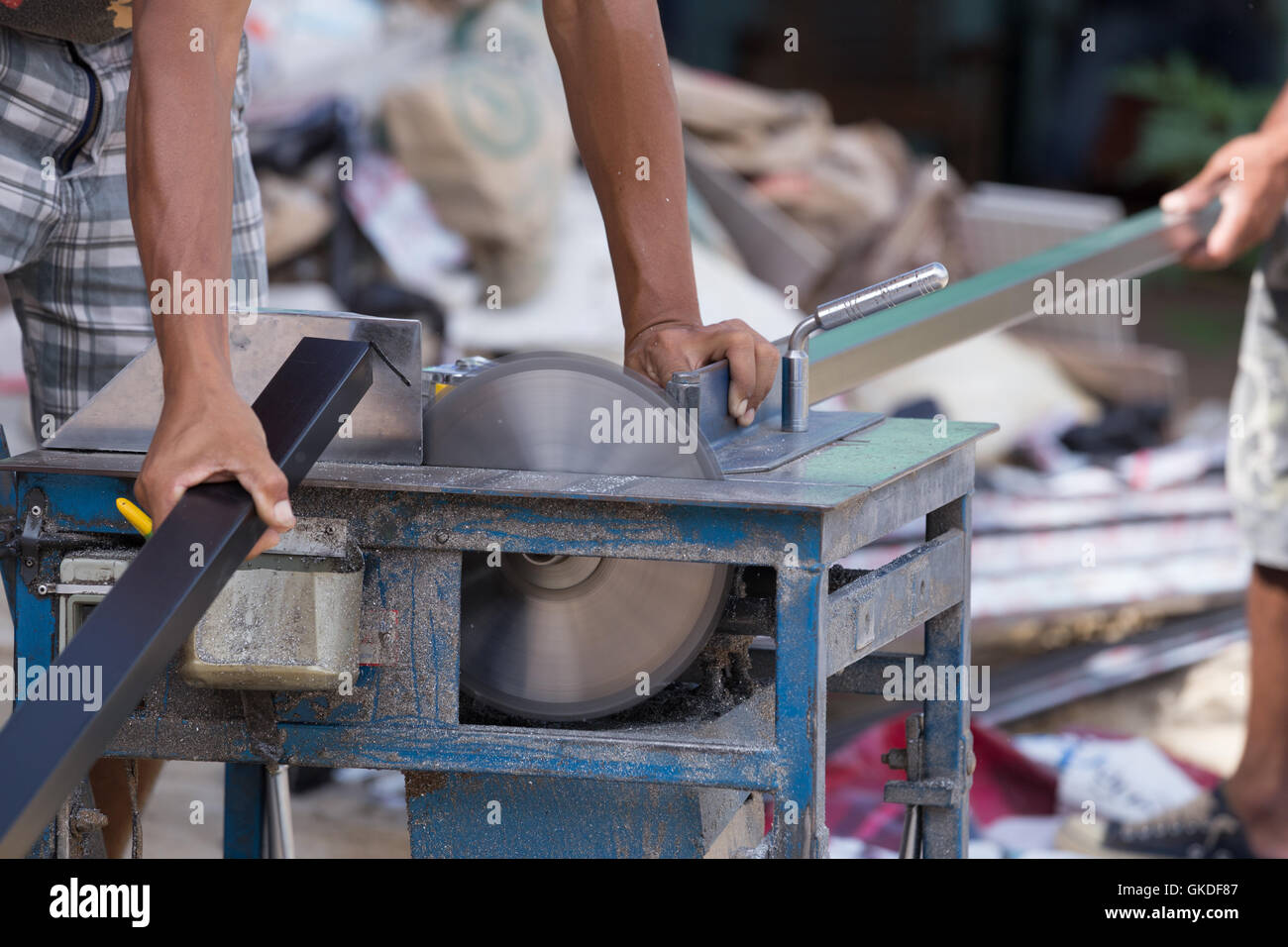 Professional Worker cutting aluminium with grinder blade Stock Photo ...