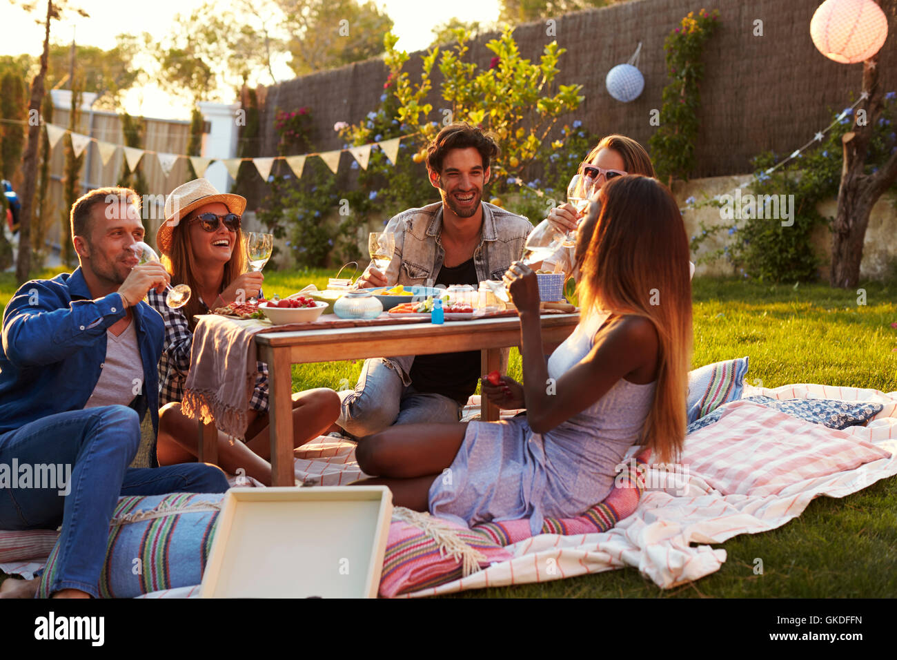 Group Of Friends Enjoying Outdoor Picnic In Garden Stock Photo - Alamy