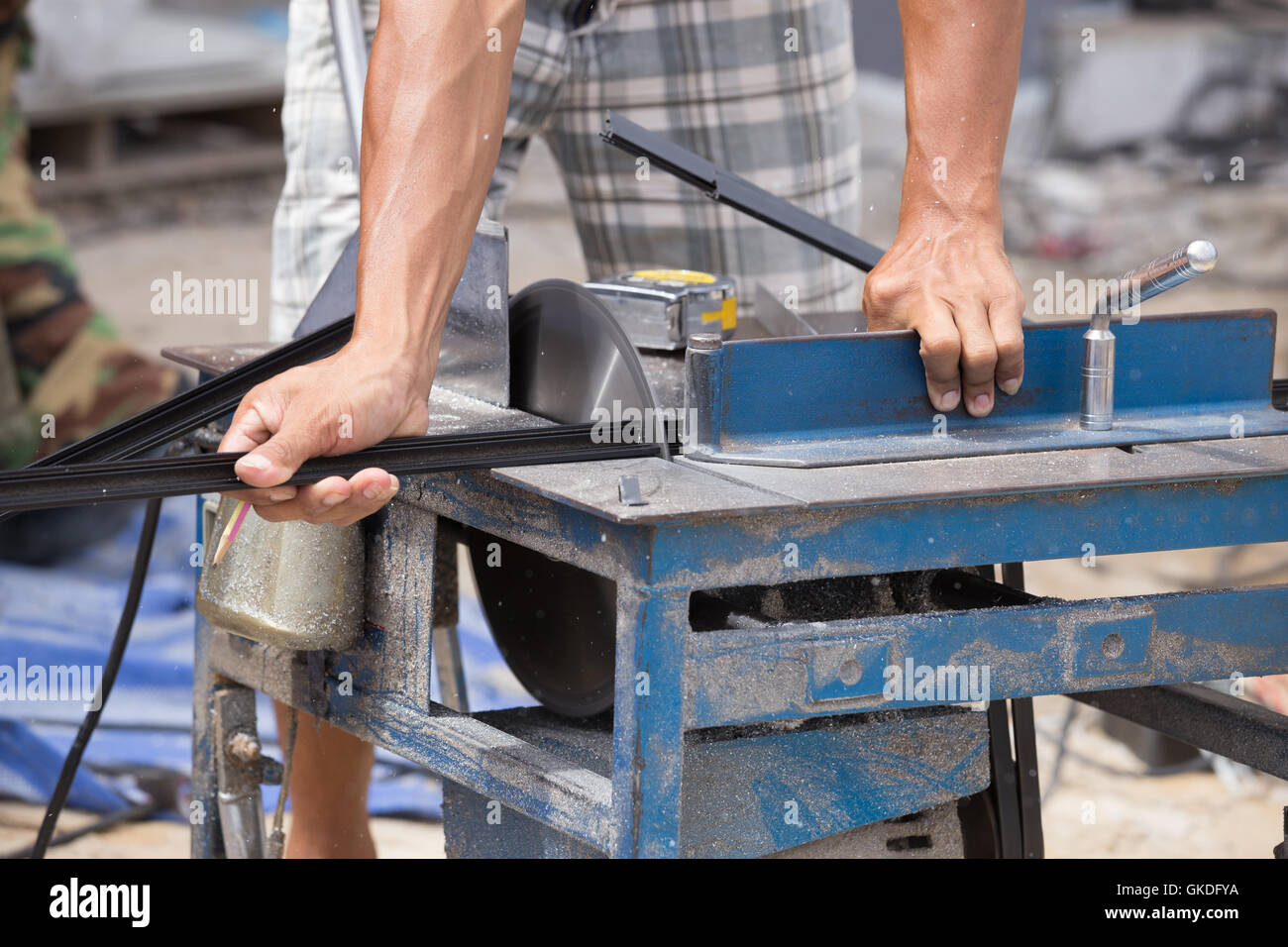 Professional Worker cutting aluminium with grinder blade Stock Photo ...