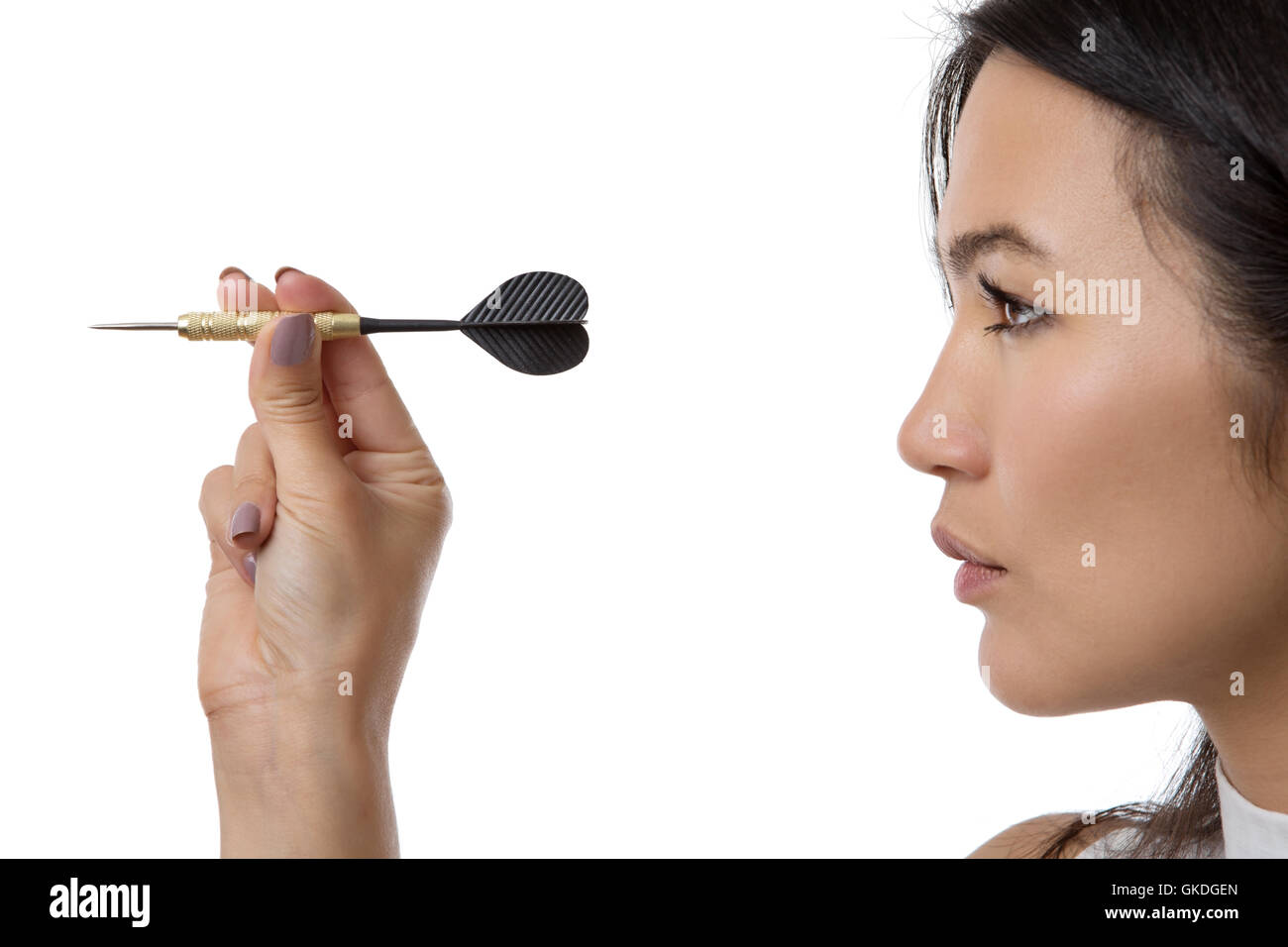 side profile close up shot of woman throwing a dart and taking aim ...