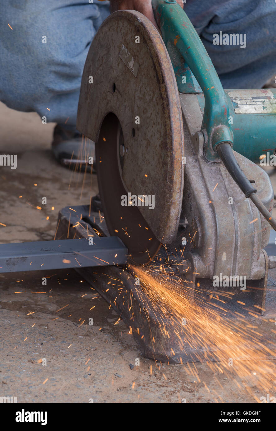 Cutting Steel with grinder. Sparks while grinding iron Stock Photo - Alamy