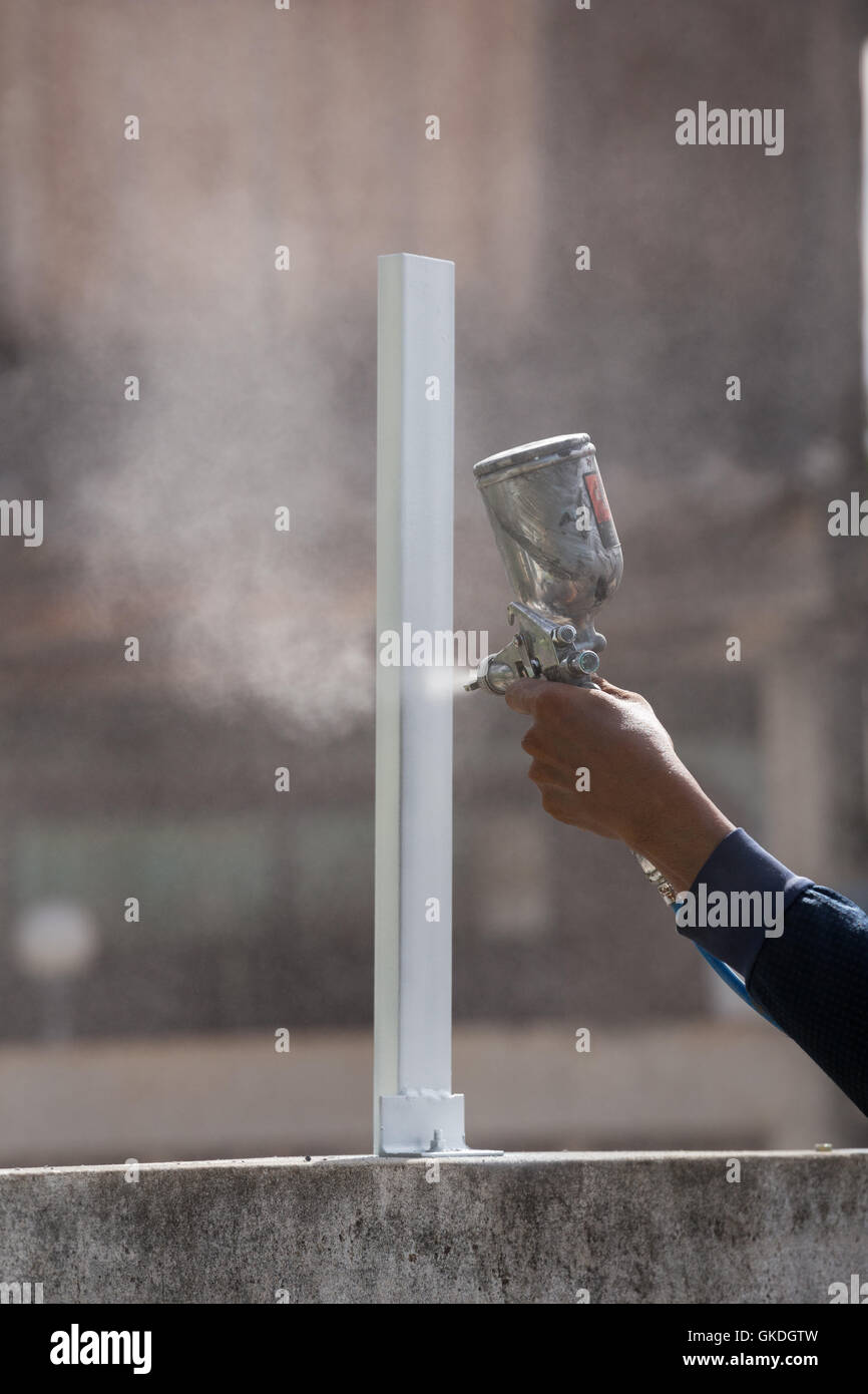 Painters were spray painting the steel frame Stock Photo - Alamy