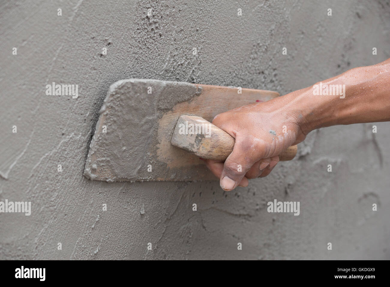 hand of builder worker use trowel plastering concrete at wall Stock ...