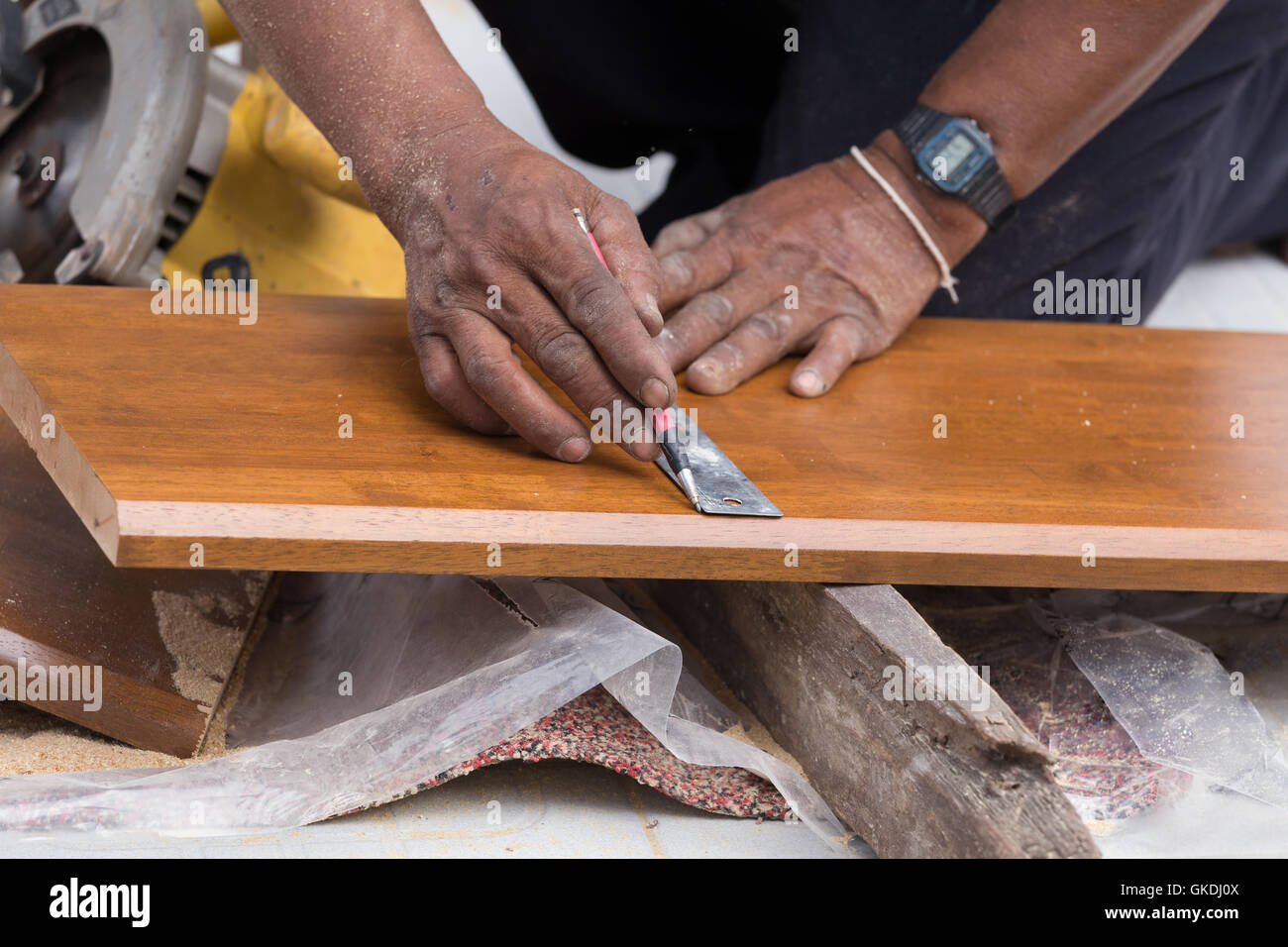 carpenter use ruler to measuring wood board Stock Photo - Alamy