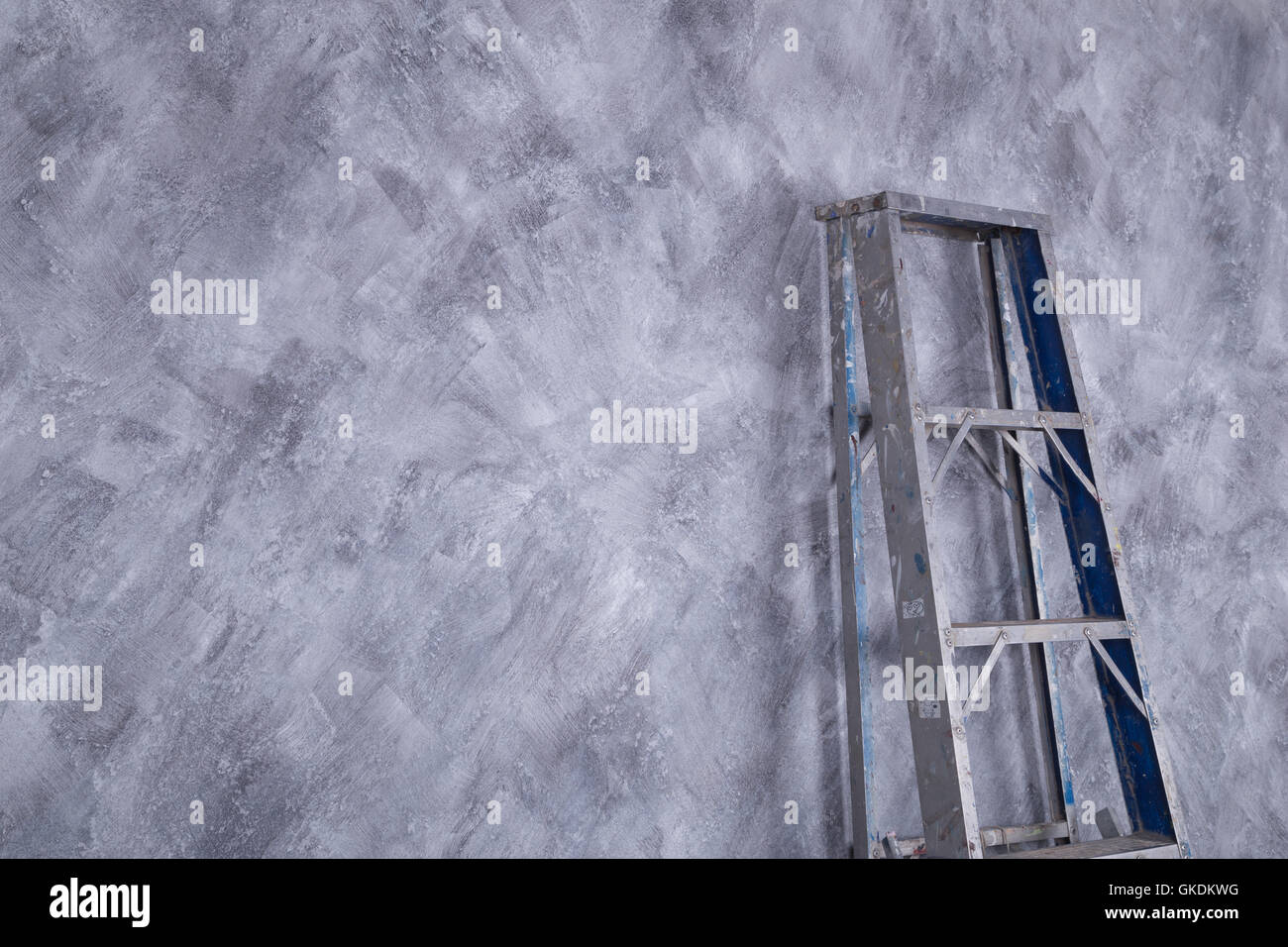 Aluminium stair over the concrete wall (Loft style Stock Photo - Alamy