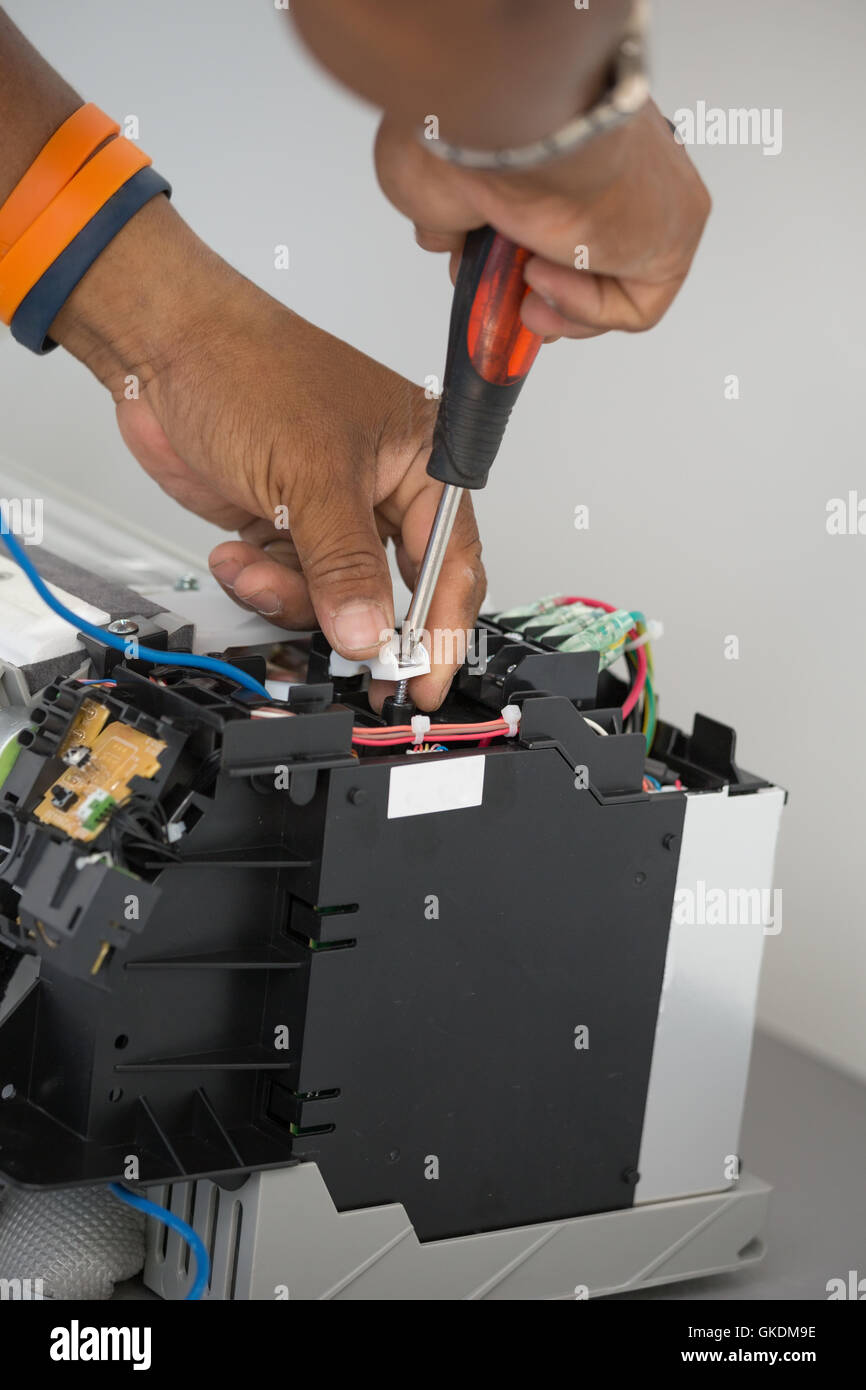 installation of the air conditioner, worker connects electric wires ...