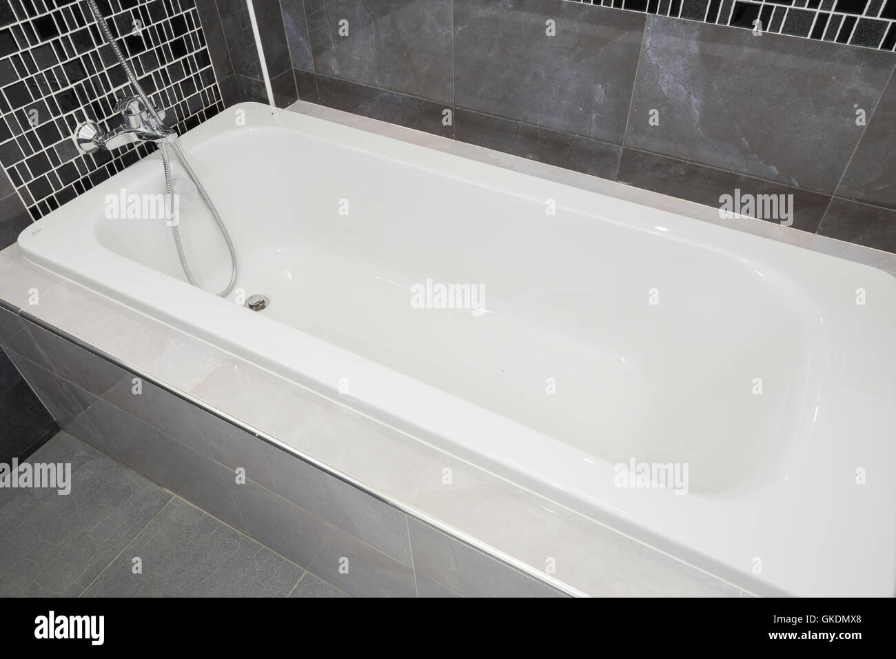 Bathtub white ceramic interior in bathroom Stock Photo - Alamy