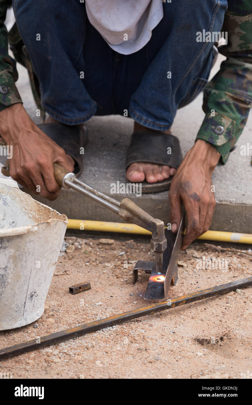 worker drilling steel plate at construction site Stock Photo - Alamy