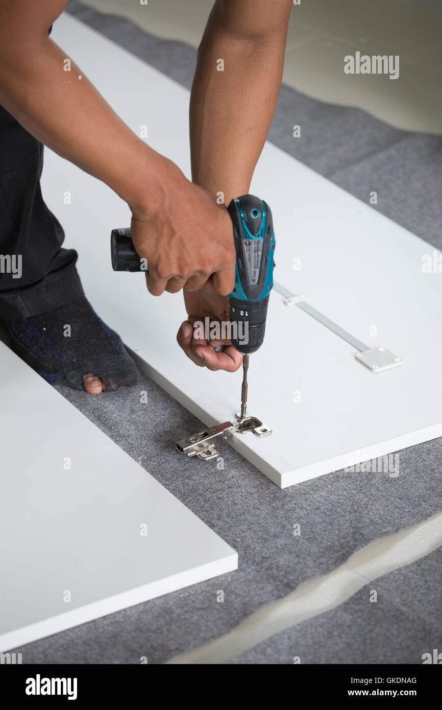 Installing furniture hinge assembling fixing hi-res stock photography ...