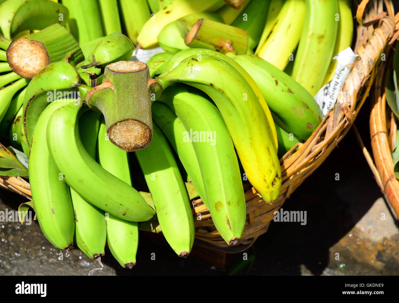 Bunch of bananas on basket Stock Photo - Alamy