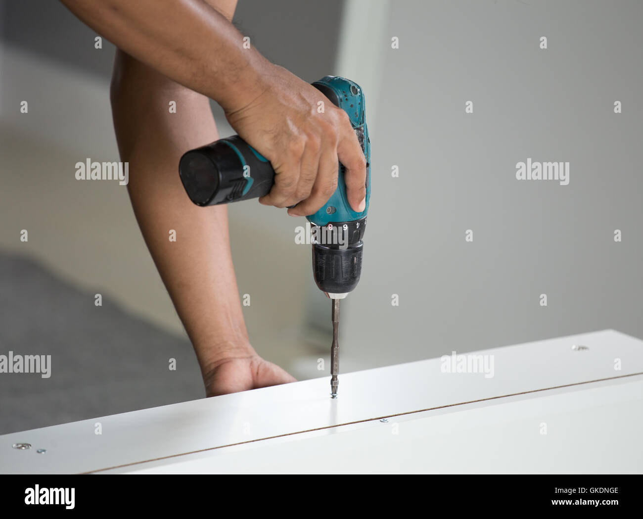 Assembling new furniture with a screwdriver Stock Photo - Alamy