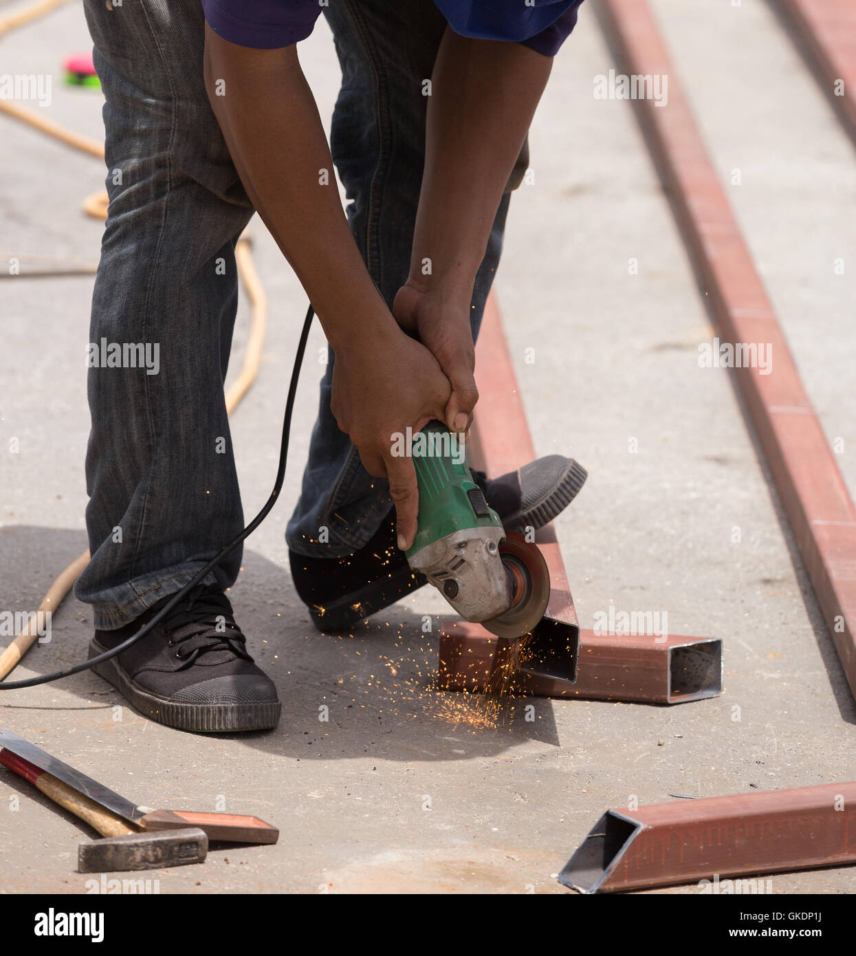Worker using angle grinder factory hi-res stock photography and images ...