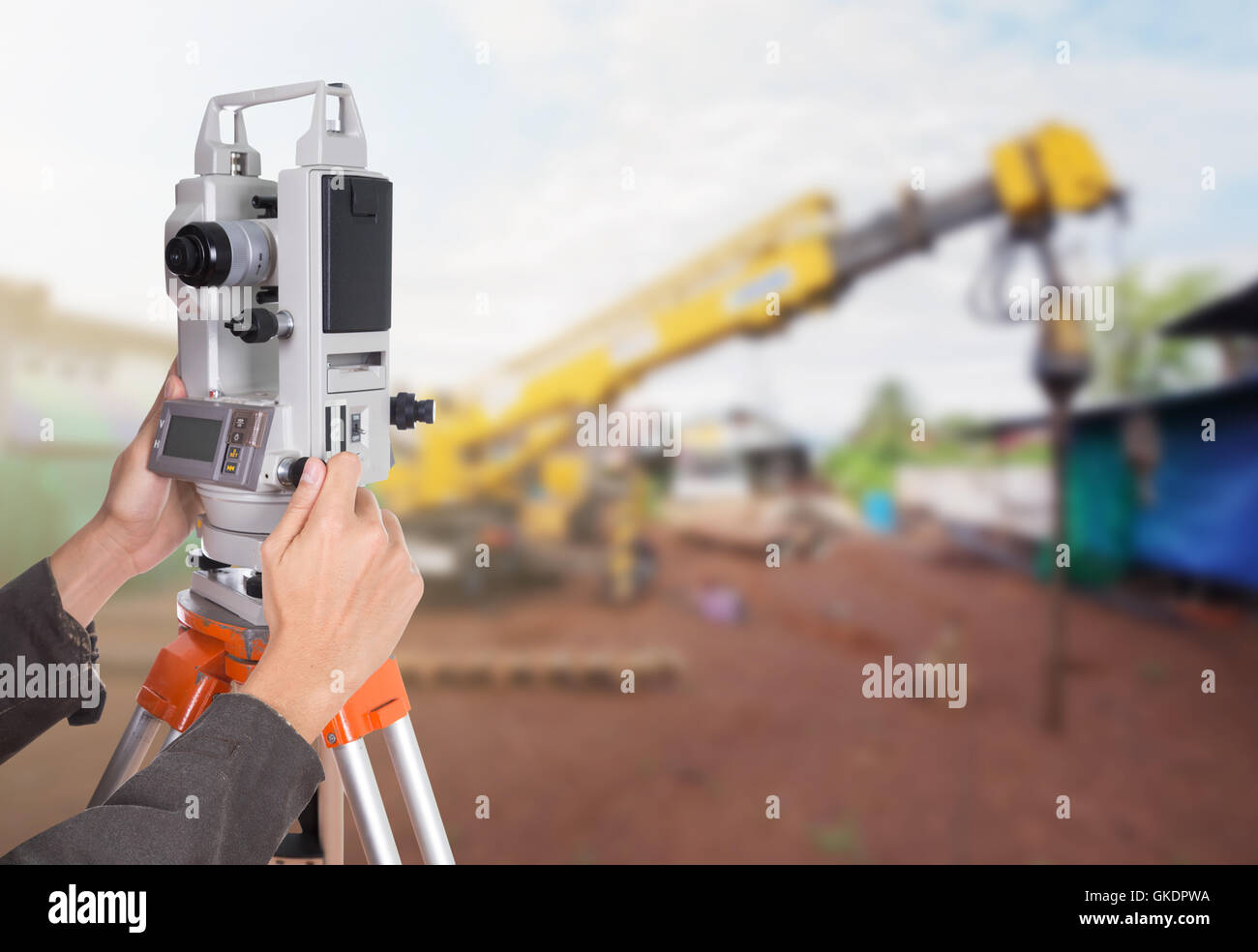 Engineers use tacheometer or theodolite with construction site ...