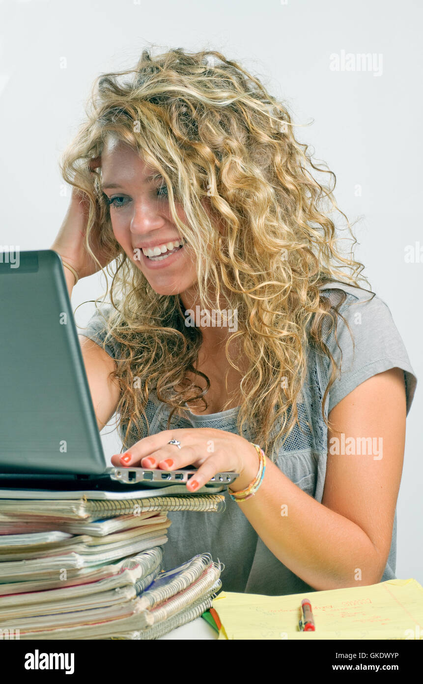 Young woman looking at computer Stock Photo - Alamy