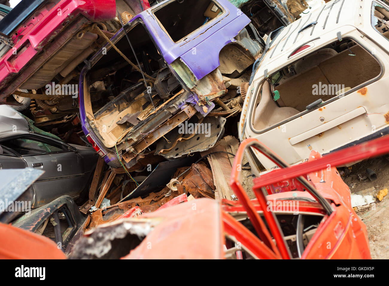 Vehicles rust on scrapyard Stock Photo - Alamy
