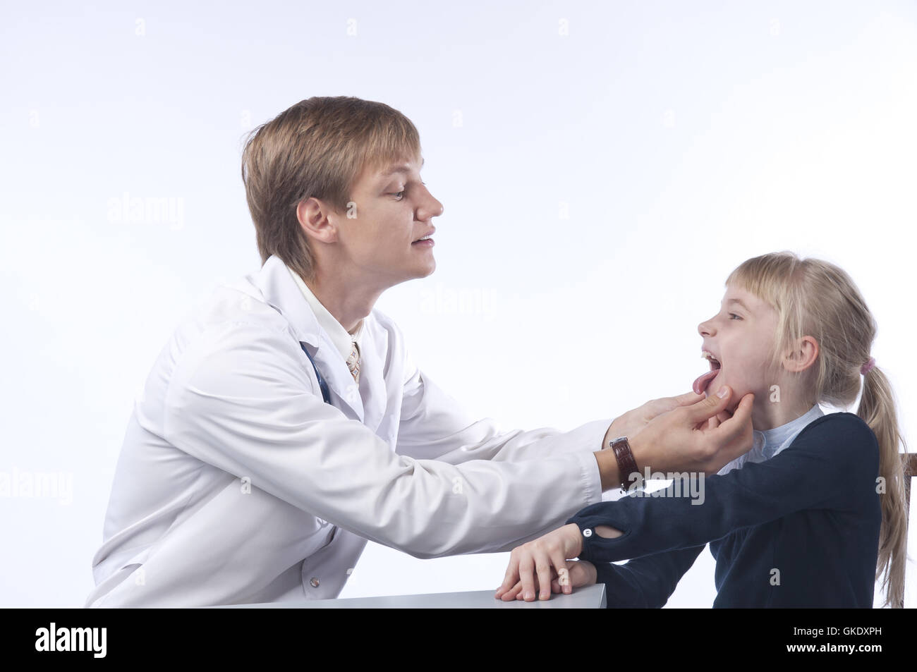 The doctor and the little girl Stock Photo - Alamy