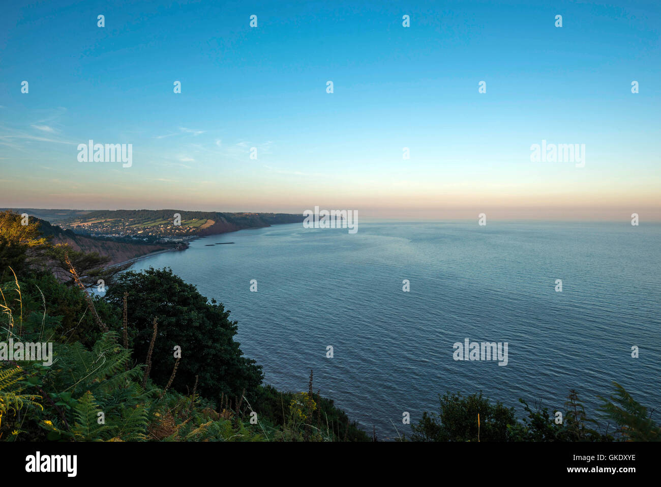 Landscape depicting the sunset and moon rise along the Jurassic coast ...