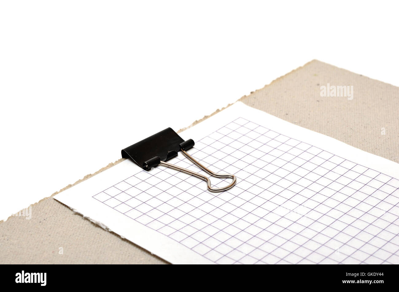 Black paperclip holding sheets of paper Stock Photo - Alamy
